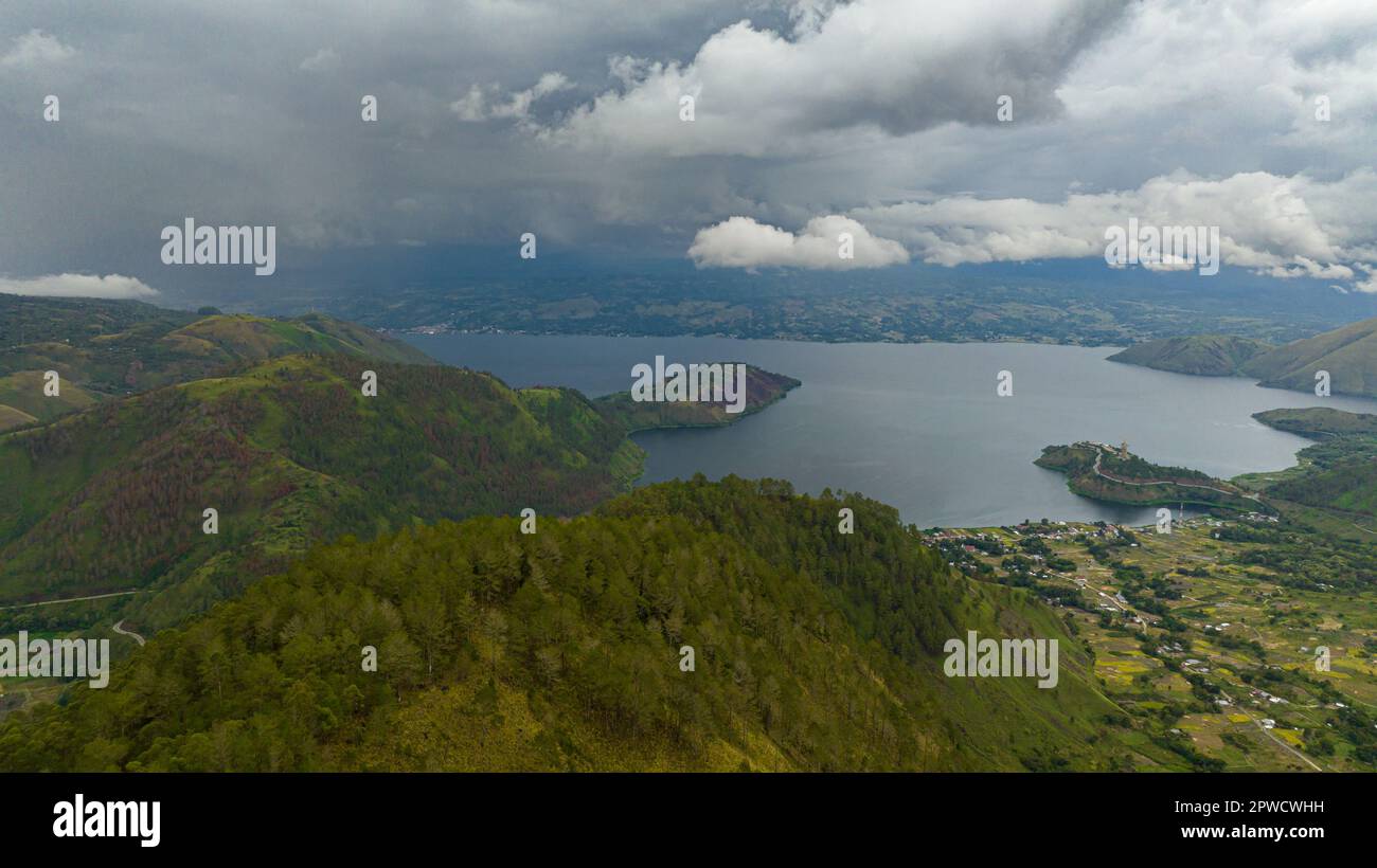Aerial drone of Lake Toba and Samosir island. among the mountains with ...