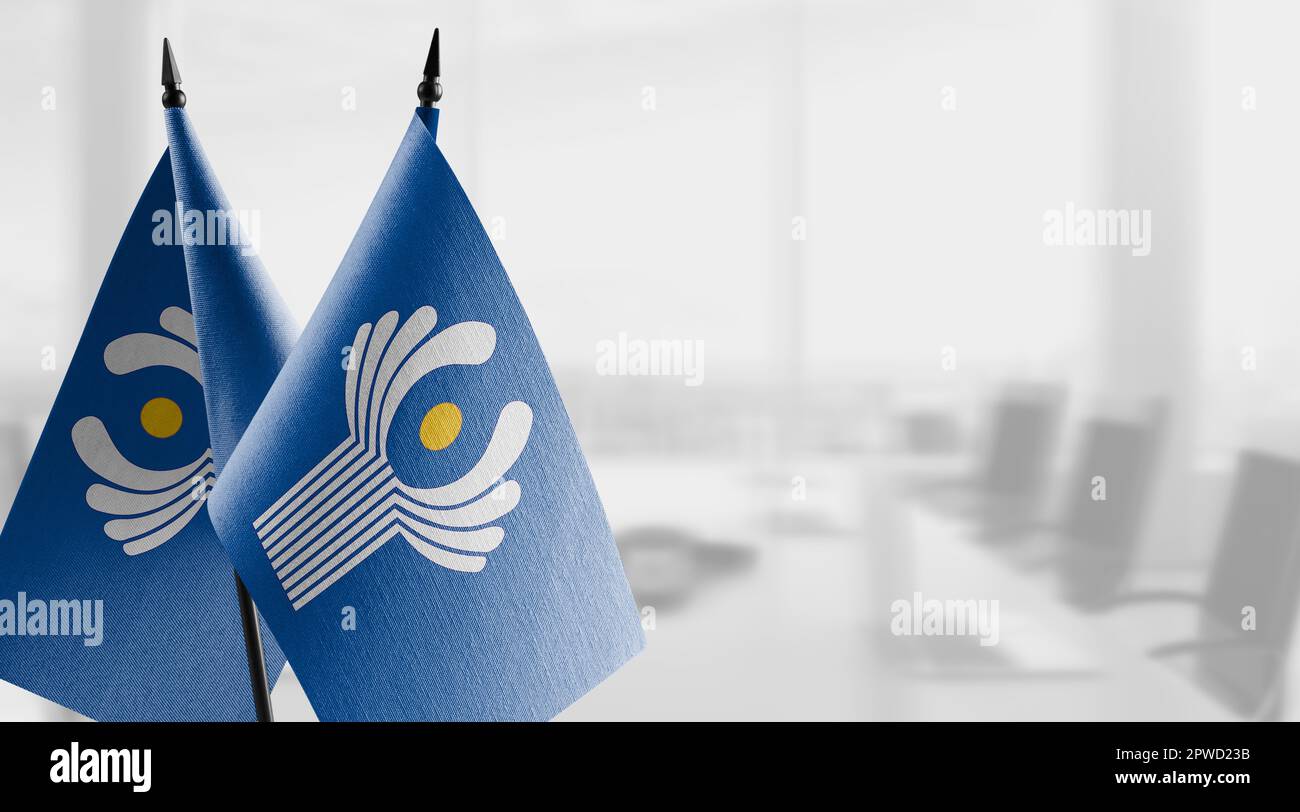 Small flags of the CIS on an abstract blurry background Stock Photo - Alamy