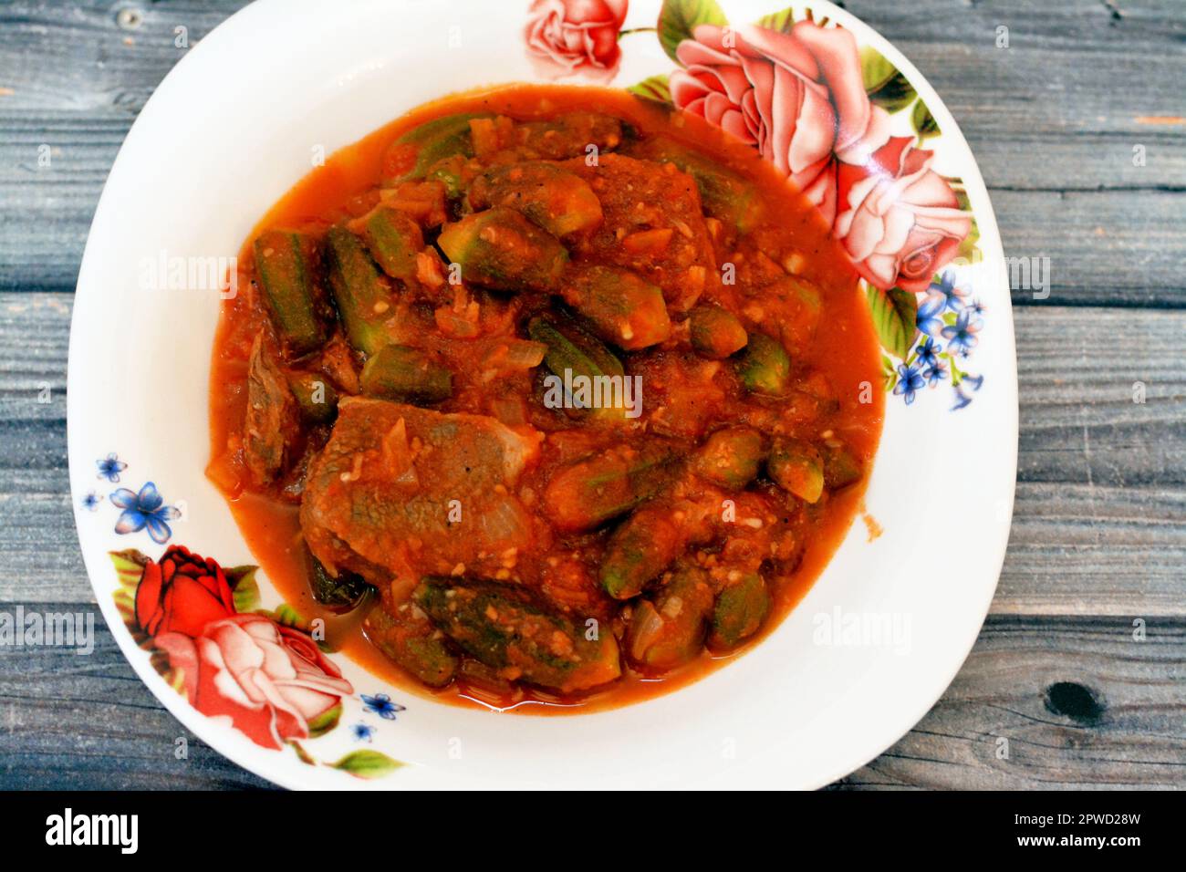 African lady cooking stew hi-res stock photography and images - Alamy