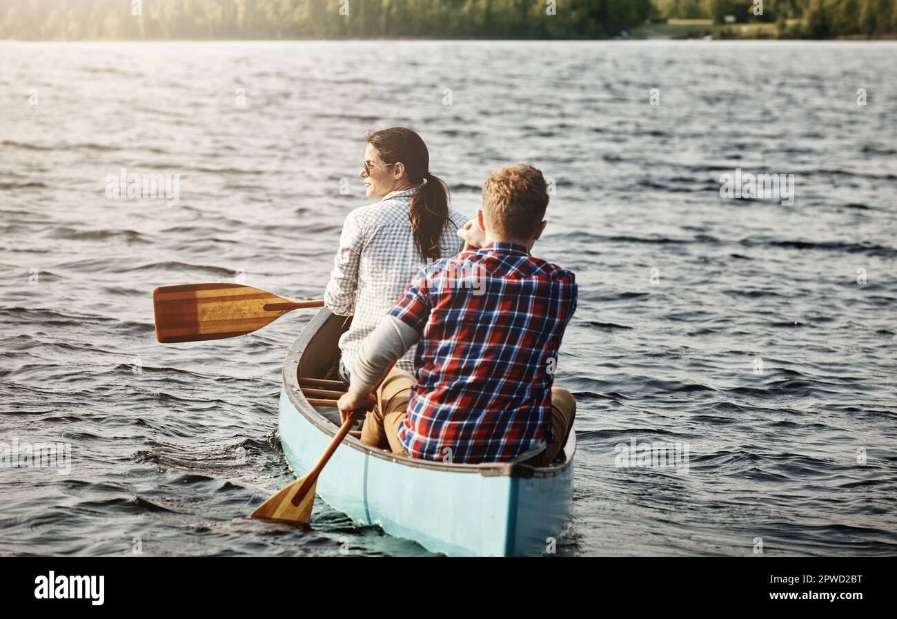 Row together, grow together. a young couple going for a canoe ride on ...