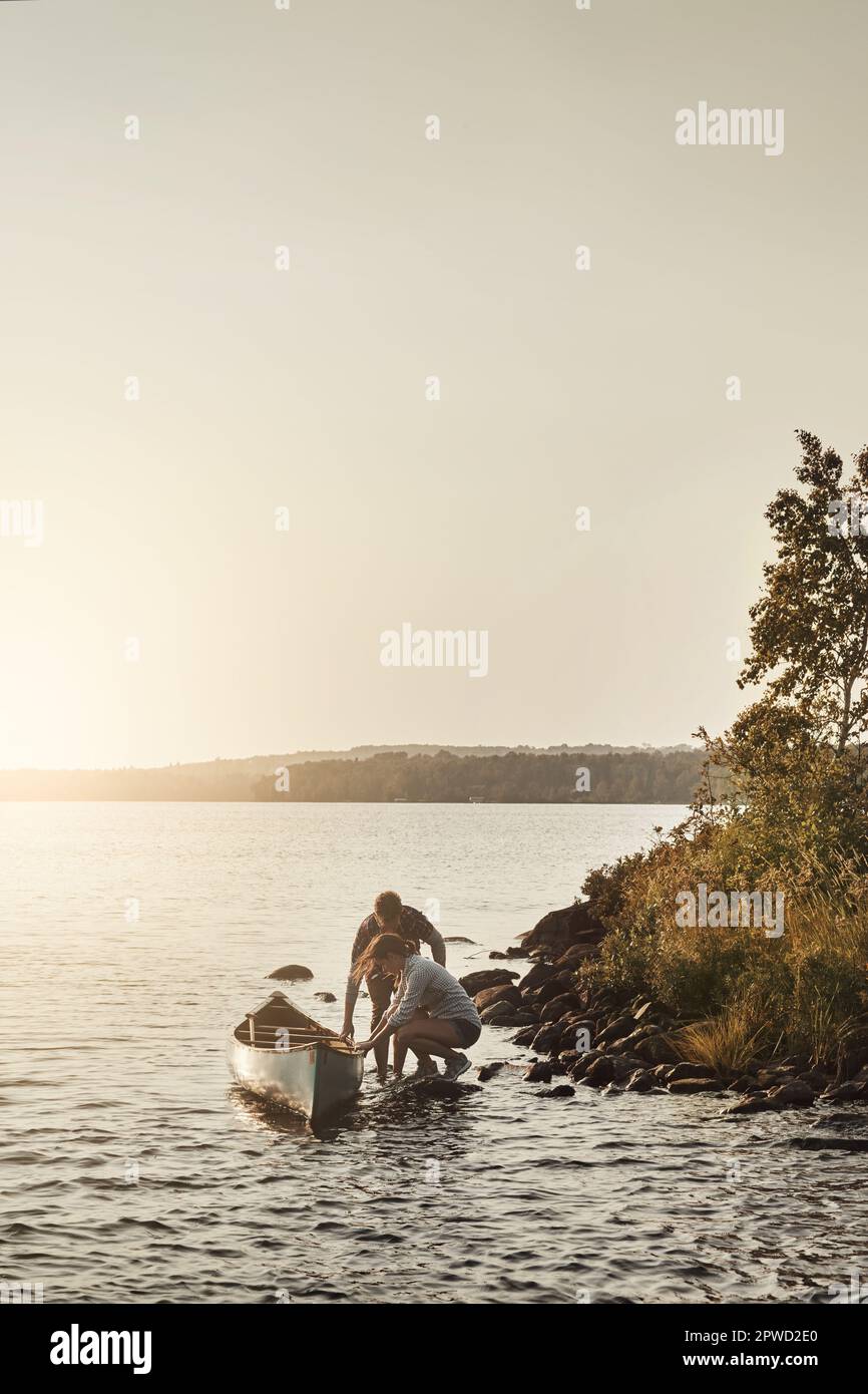 Grab your canoe and row. a young couple going for a canoe ride on the ...