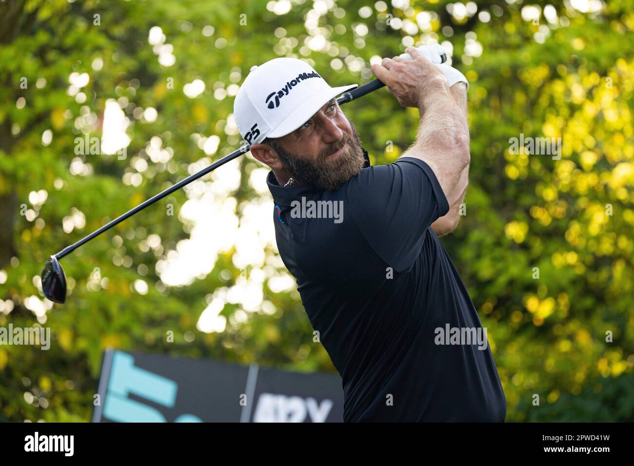 Captain Dustin Johnson of 4Aces GC hits his shot from the 16th tee ...