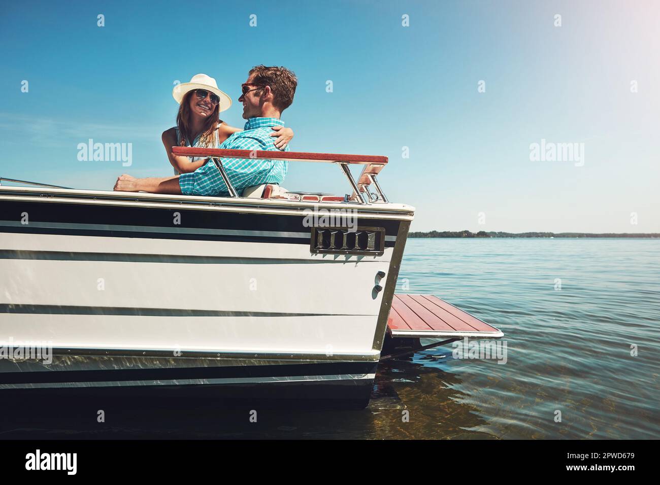 Experiencing nature from the comfort of a boat. a young couple spending ...