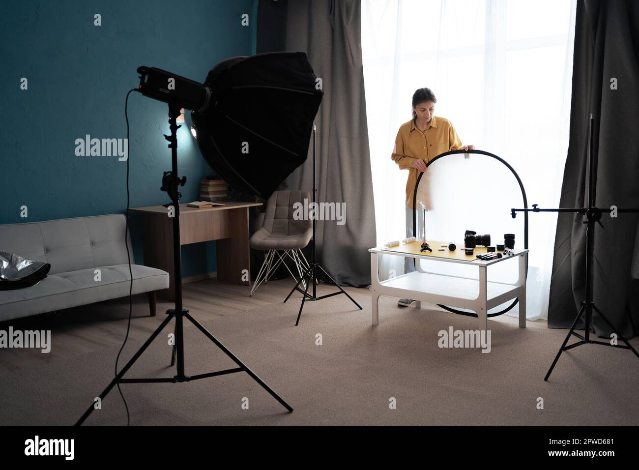 Woman photographer setting up digital hi-res stock photography and ...