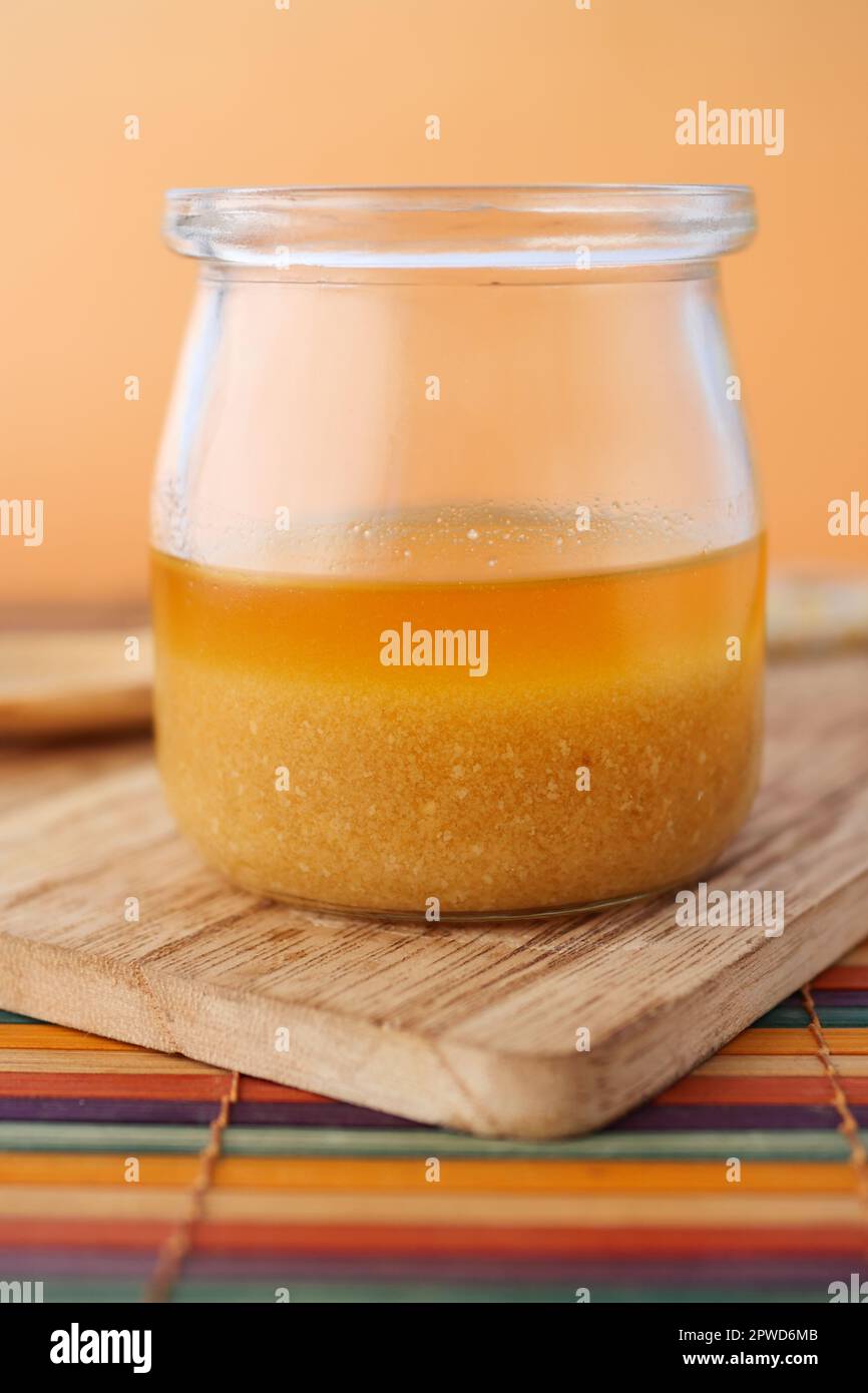 homemade ghee in container on a table Stock Photo - Alamy