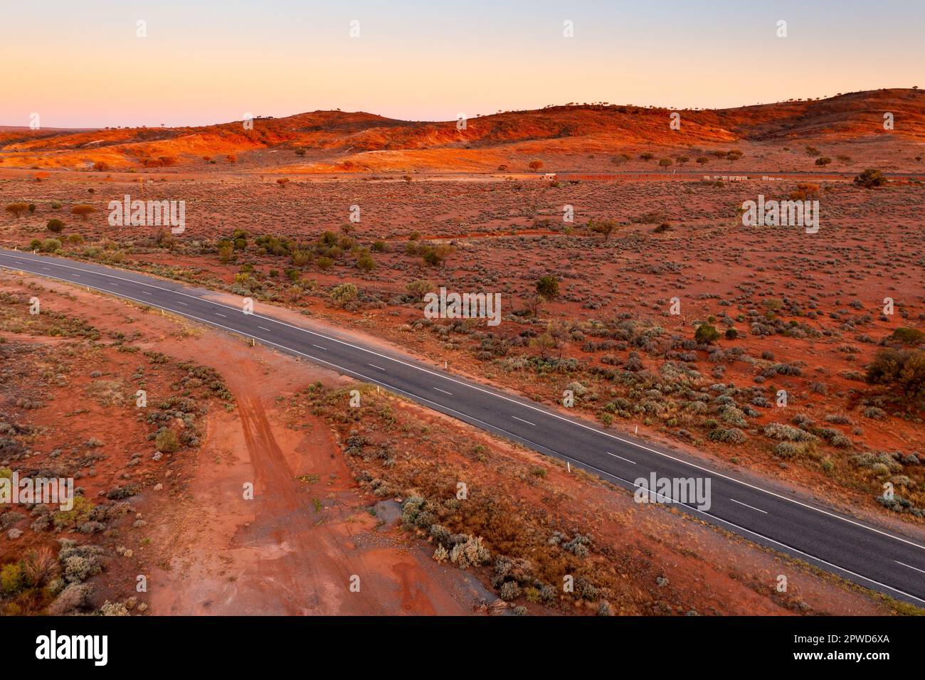 Aerial view of a highway cutting through a desert landscape at Broken ...