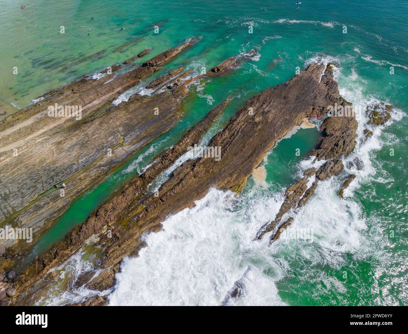 Aerial view of rocky reefs in a turquoise ocean at Snapper Rocks on the ...