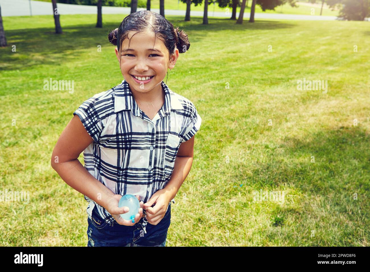 Have fun little one. an adorable little girl ready to throw balloons ...