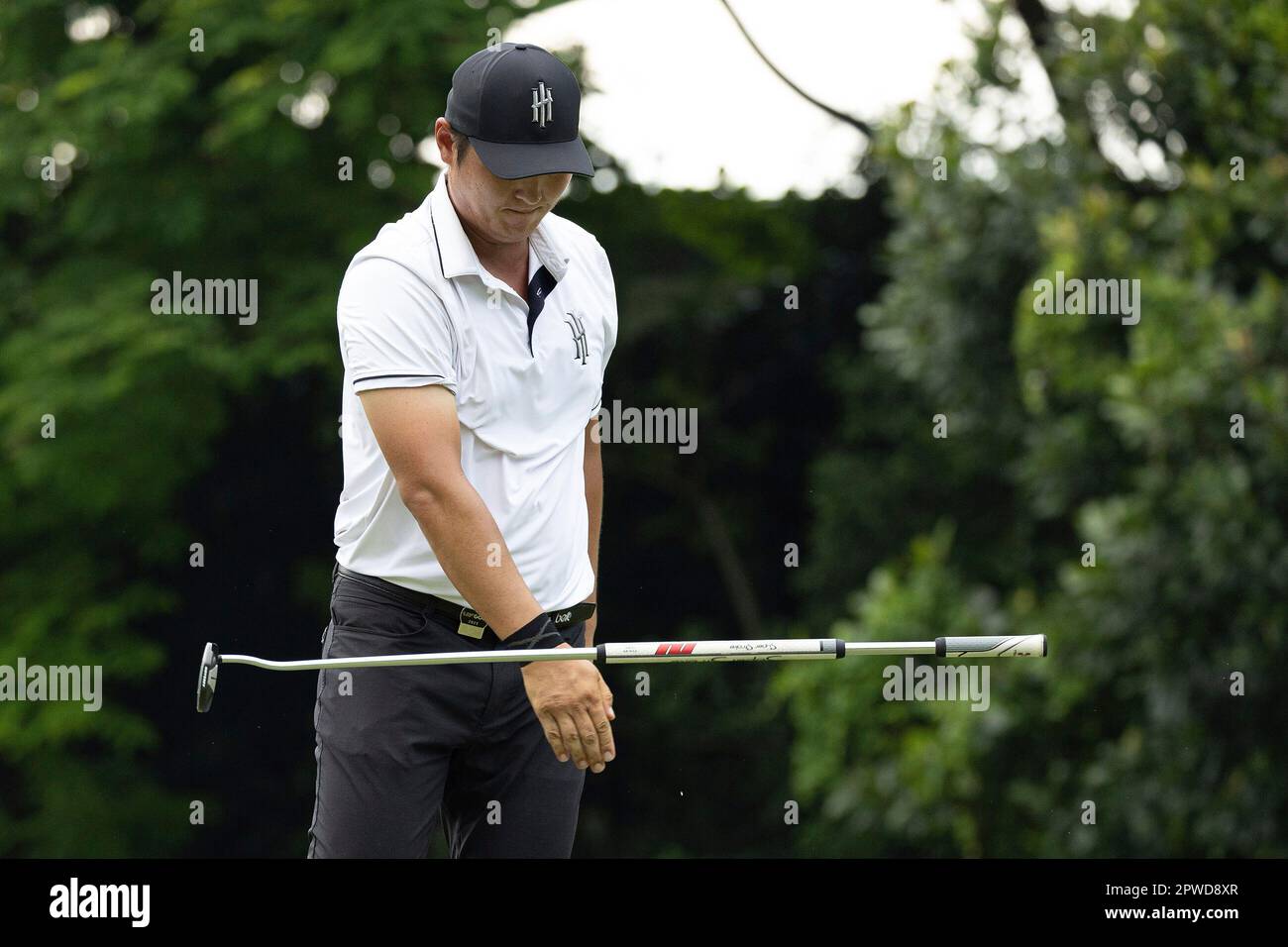 Danny Lee of Iron Heads GC throws his club after missing his putt on ...