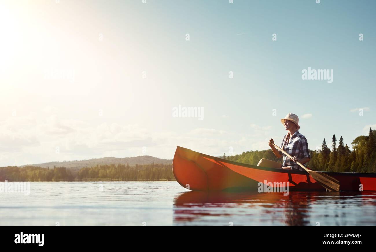 Living that kayak life. an attractive young woman spending a day ...