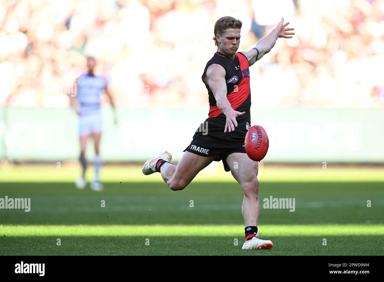 Ben Hobbs of Essendon kicks the footy during the AFL Round 7 match ...