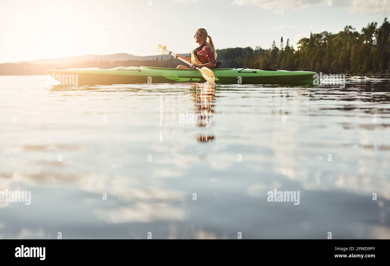 The sunset is whats most beautiful. an attractive young woman out for ...