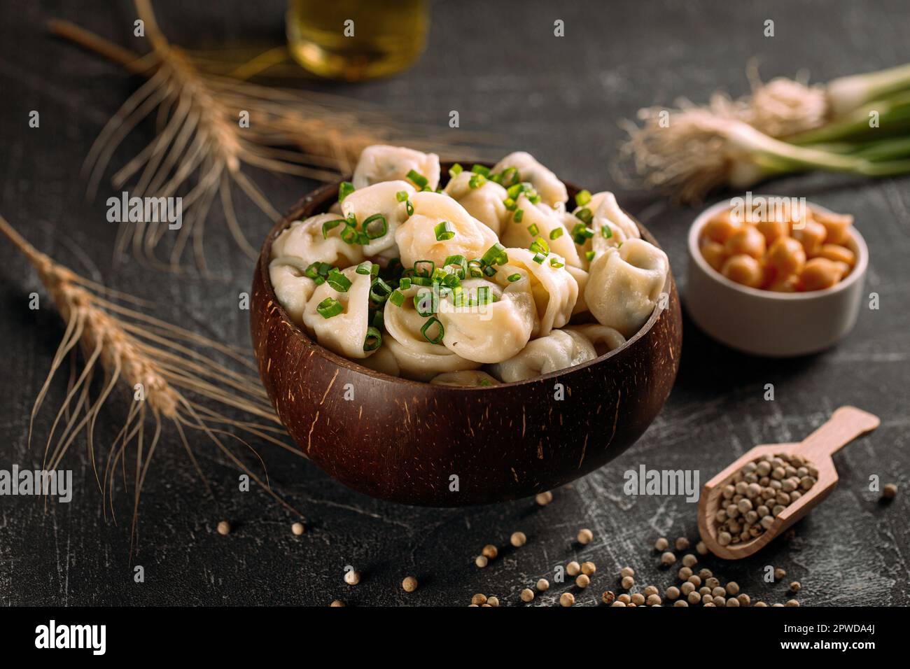 Russian dumplings pelmeni with spring onion Stock Photo - Alamy