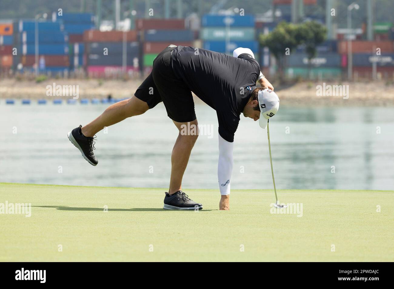 Peter Uihlein of 4Aces GC takes his ball from the cup on the 14th green ...