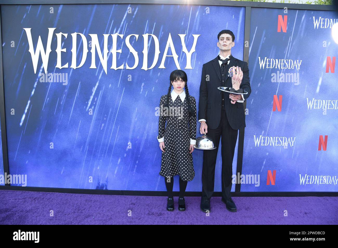 Performers wearing Wednesday and Lurch costumes attend a photo call ...