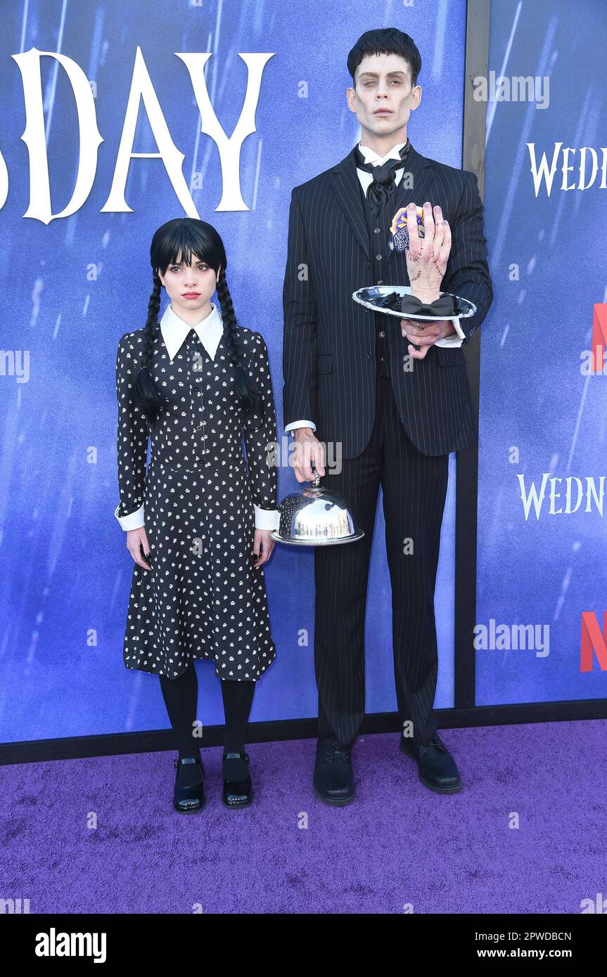 Performers wearing Wednesday and Lurch costumes attend a photo call ...