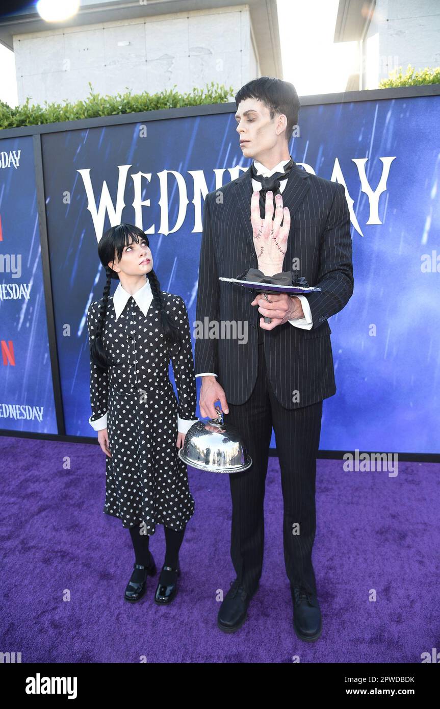 Performers wearing Wednesday and Lurch costumes attend a photo call ...