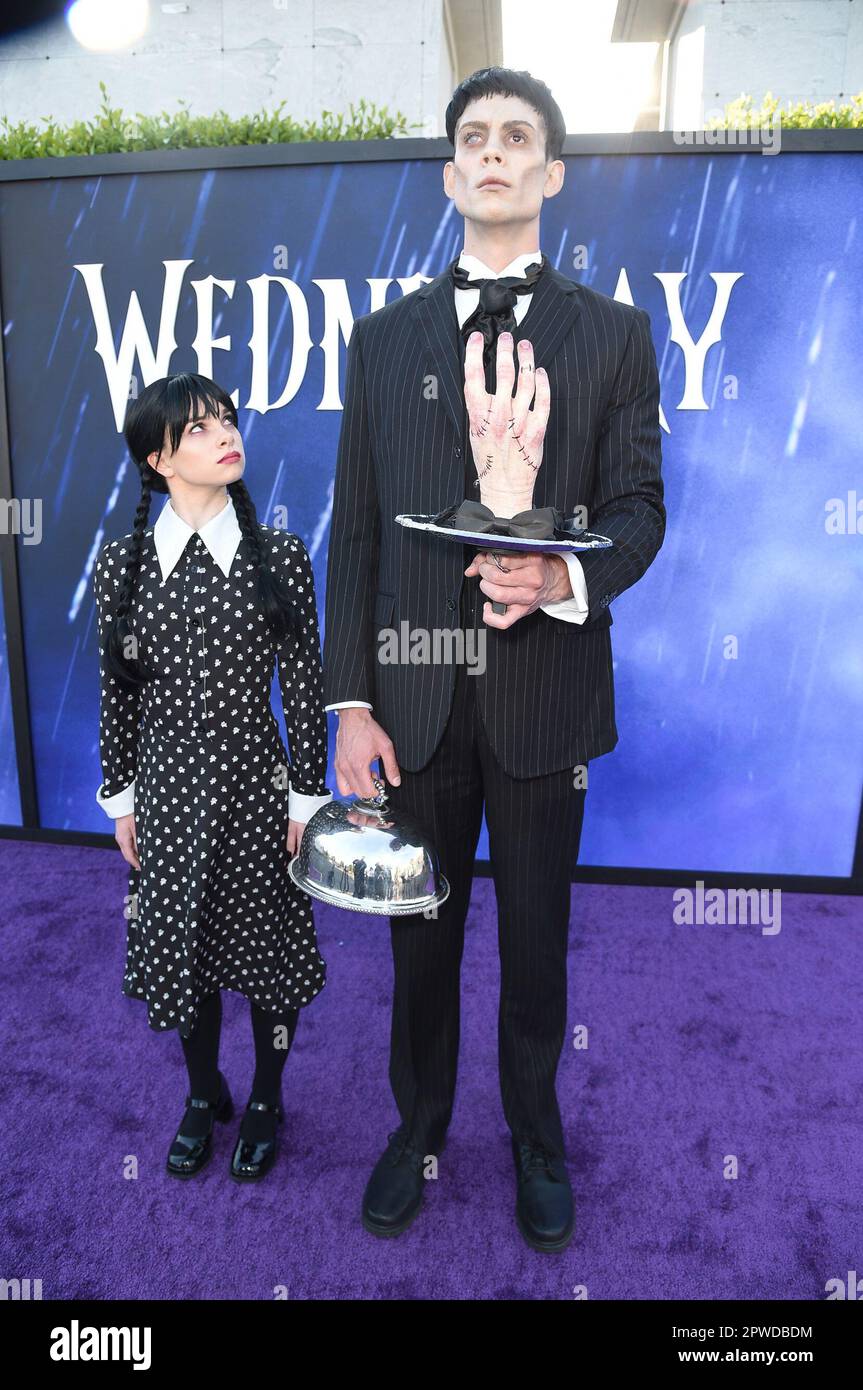 Performers wearing Wednesday and Lurch costumes attend a photo call ...