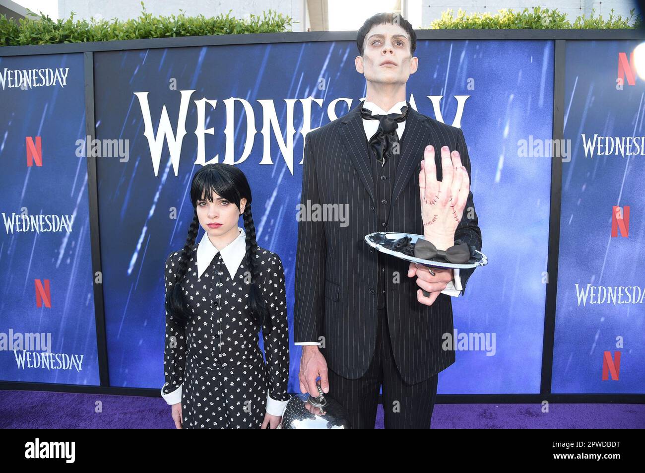 Performers wearing Wednesday and Lurch costumes attend a photo call ...