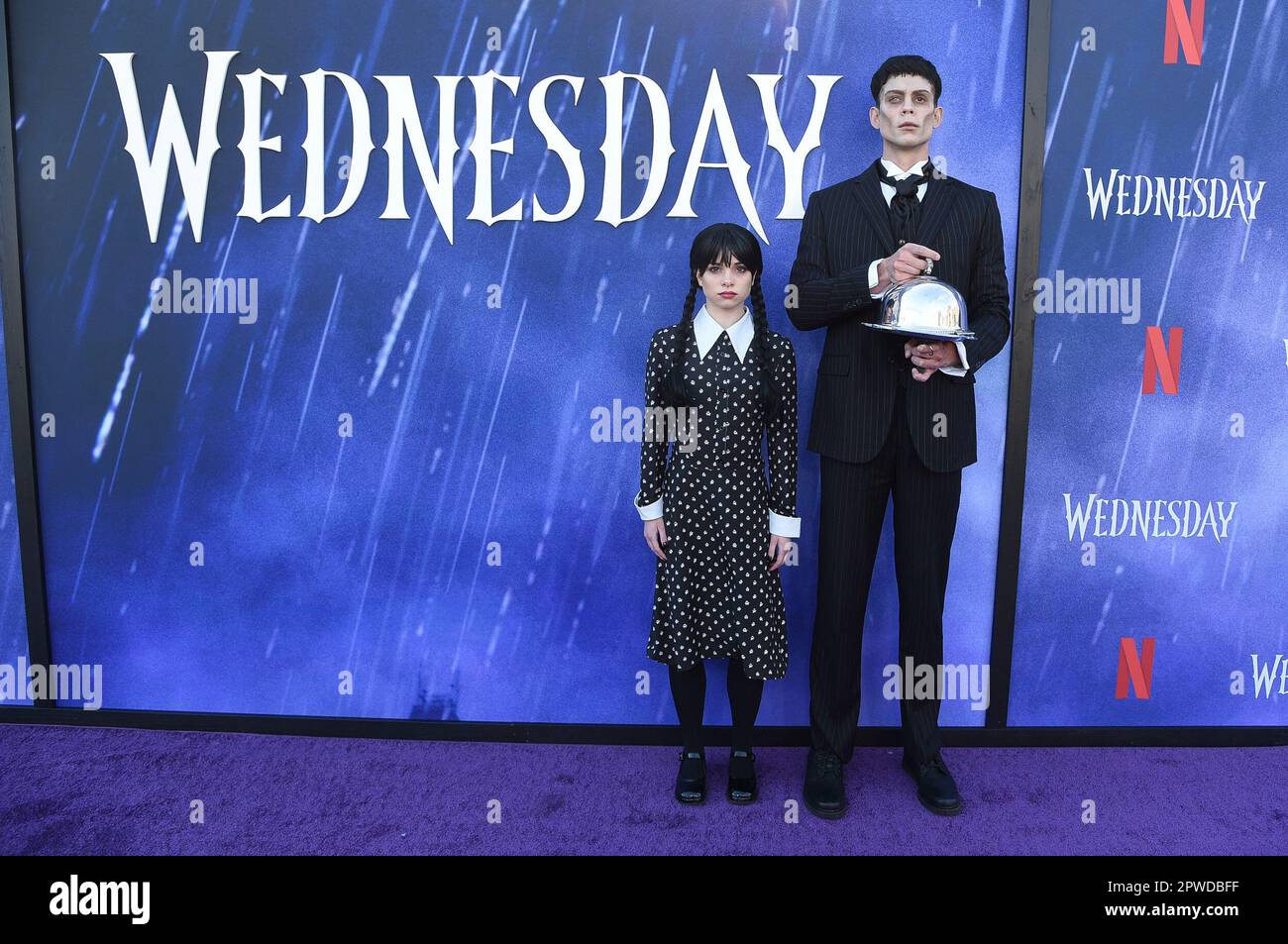 Performers wearing Wednesday and Lurch costumes attend a photo call ...