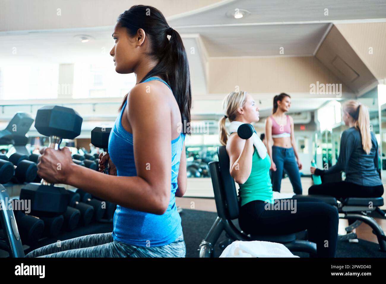 Getting stronger with every session. attractive young women working out ...