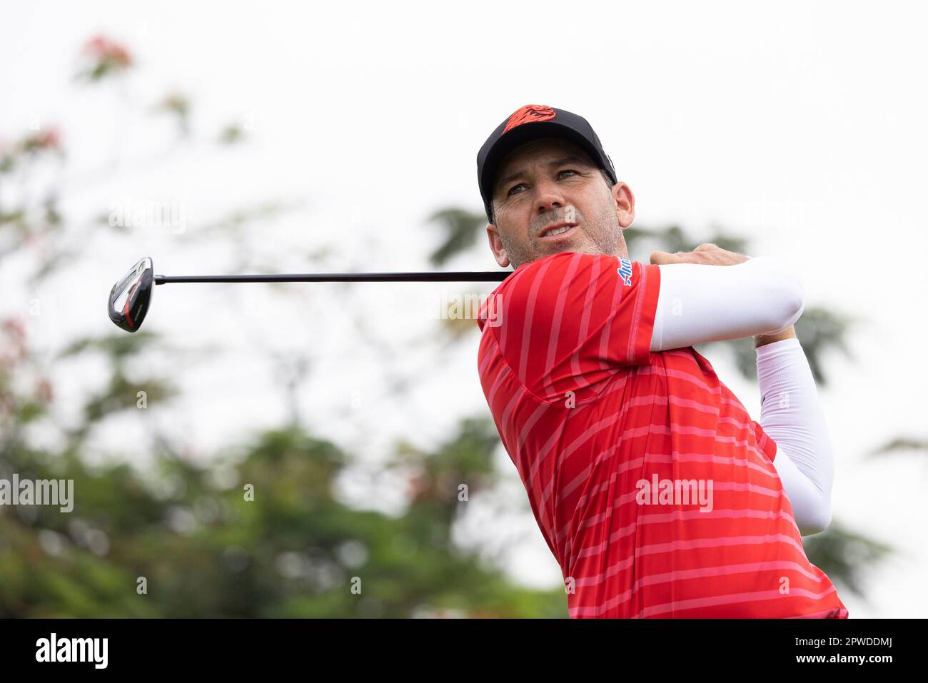 Captain Sergio Garcia of Fireballs GC hits his shot from the 18th tee ...
