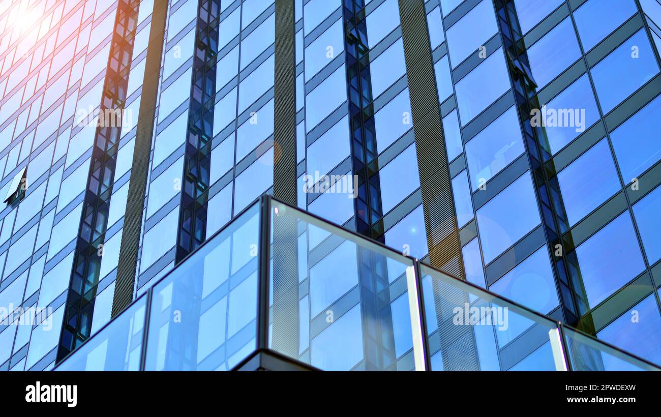 Windows of a modern glass building. Looking up at the commercial ...