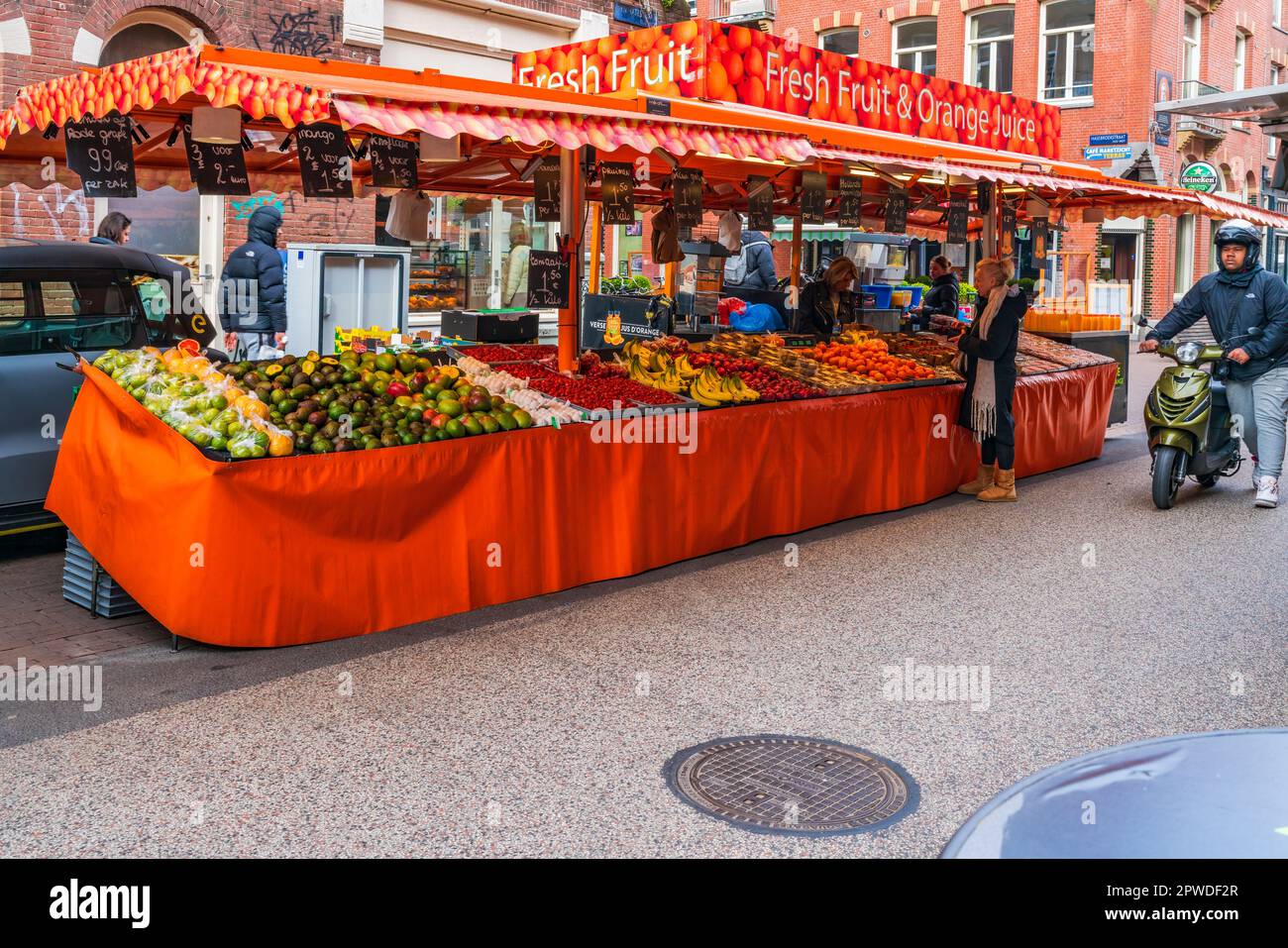 AMSTERDAM, HOLLAND - APRIL 18, 2023: Shoppers buying fresh produce at ...