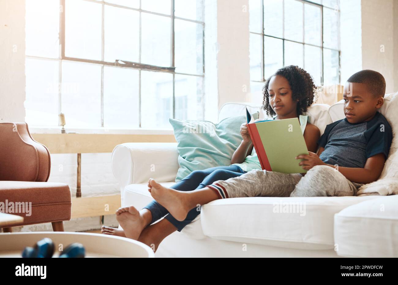 Siblings that read together need each other. a little brother and ...