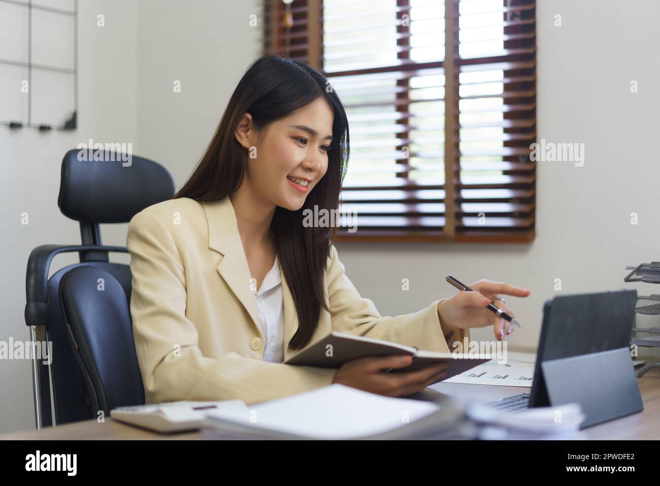 Secretary concept, Female secretary pointing business data on tablet ...
