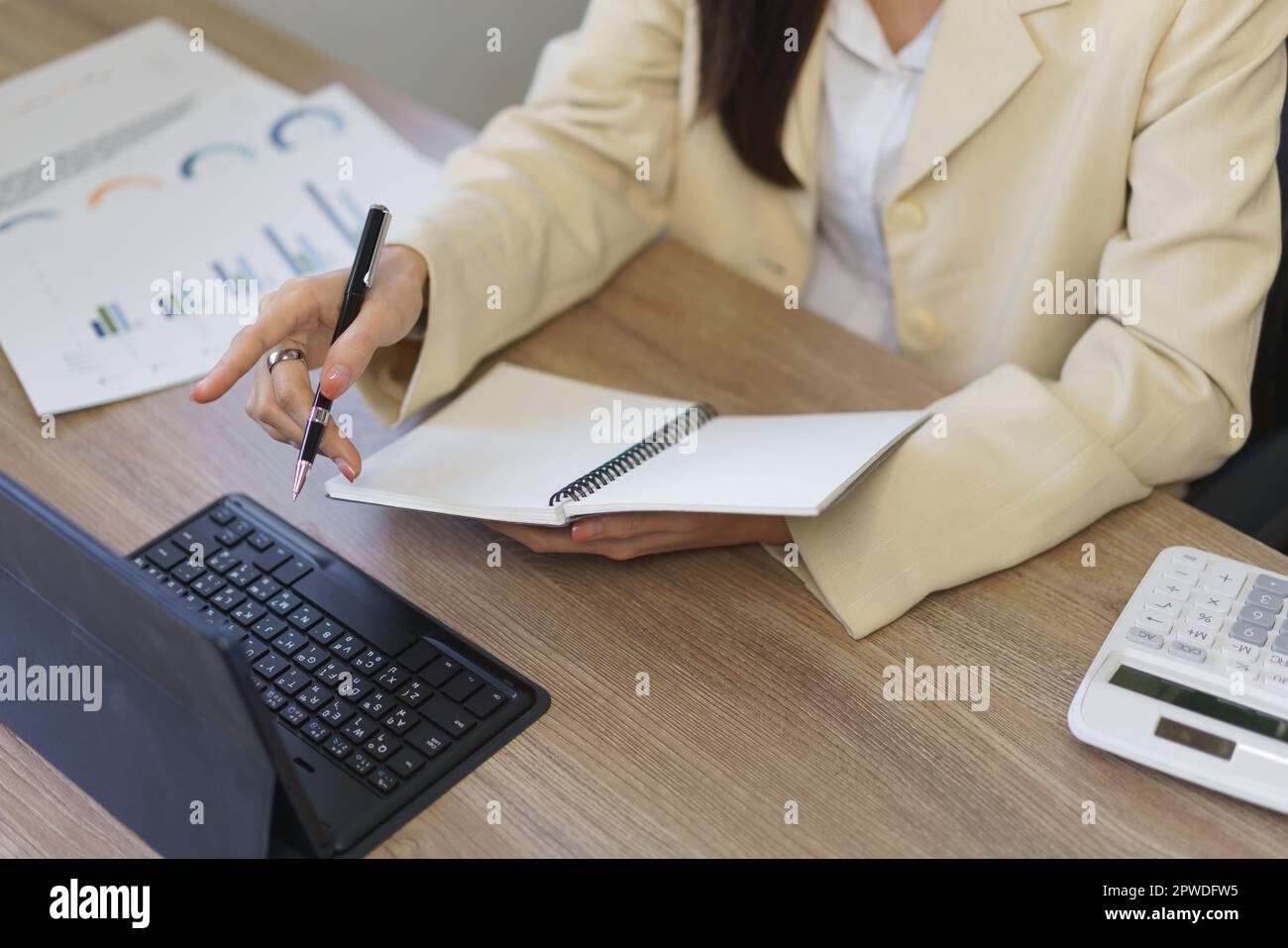Secretary concept, Female secretary pointing business data on tablet ...