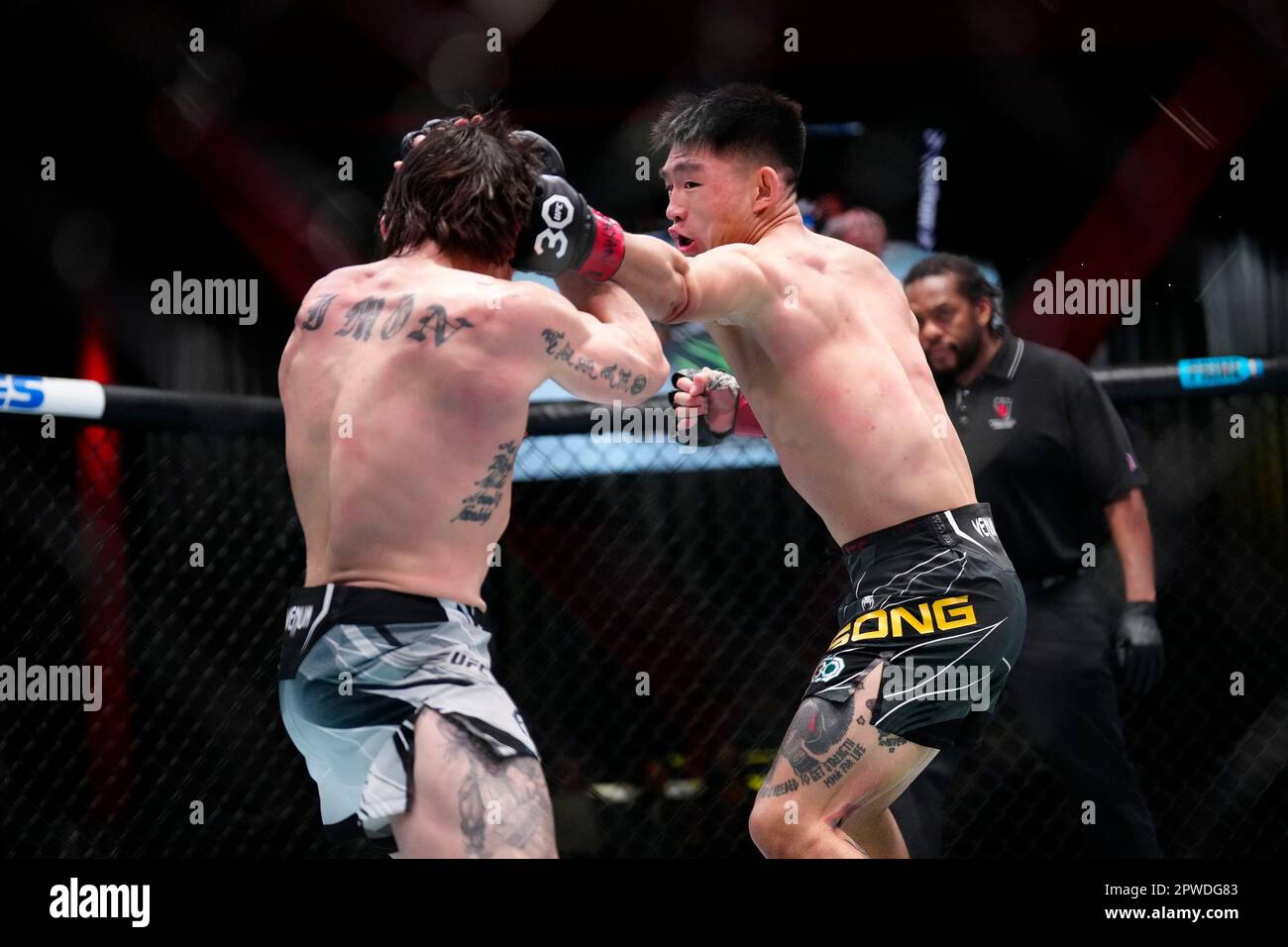 LAS VEGAS, NV - April 29: (R-L) Song Yadong punches Ricky Simon fight ...