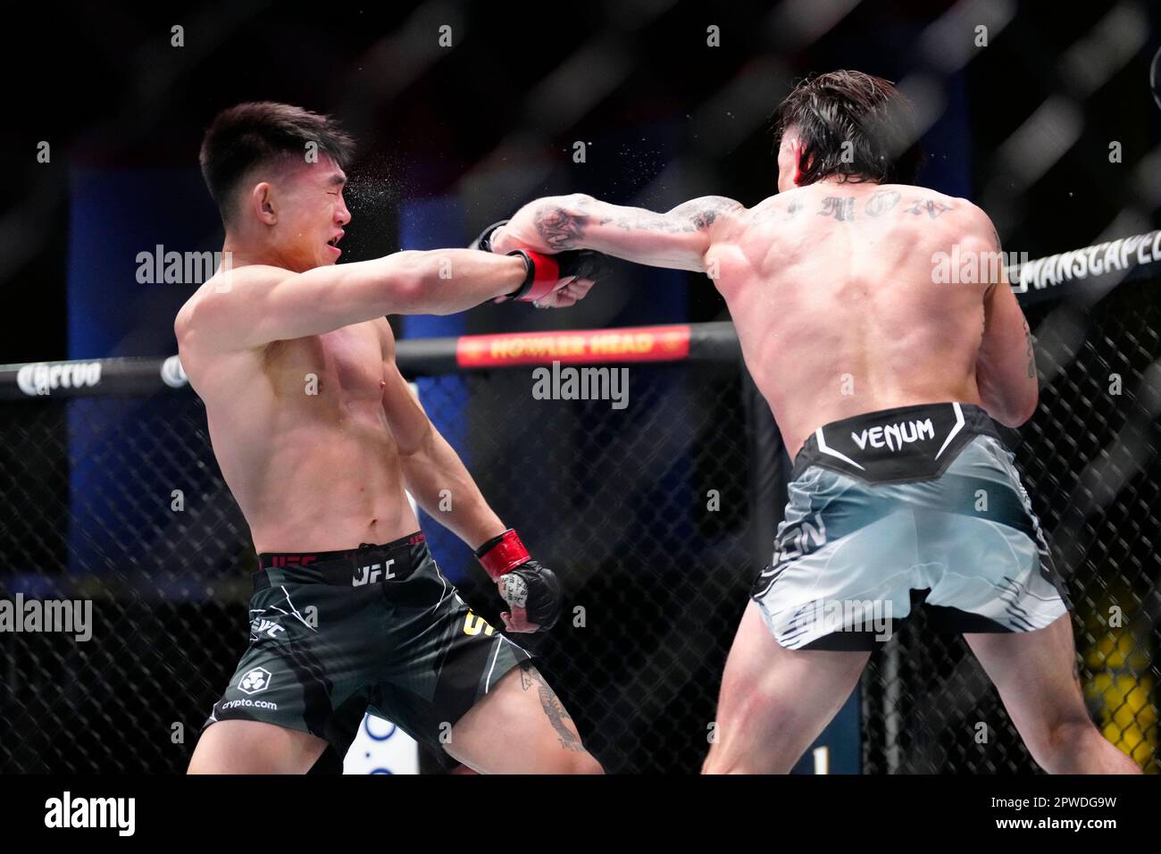 LAS VEGAS, NV - April 29: (R-L) Ricky Simon punches Song Yadong fight ...