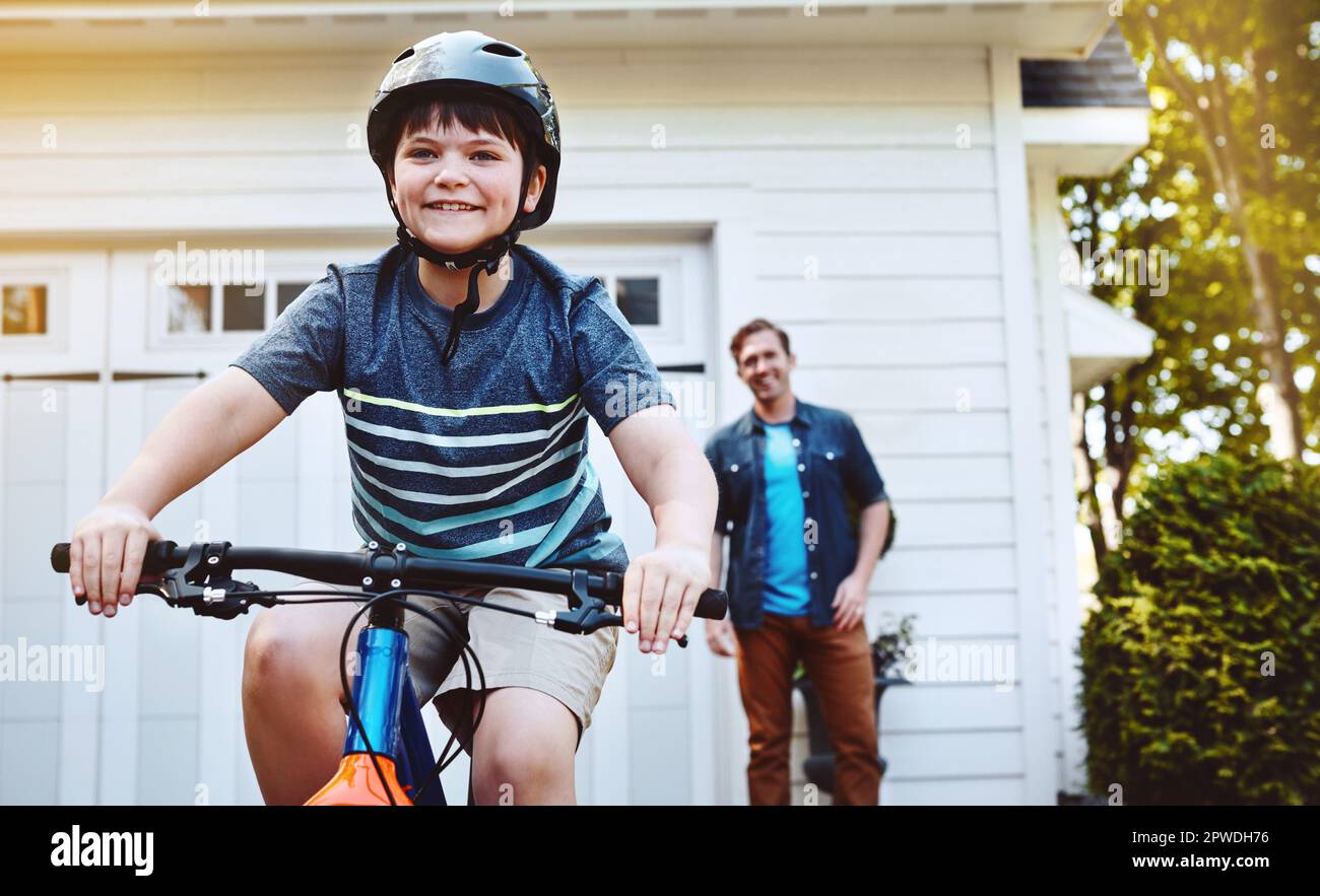 Learning to ride a bicycle is one of lifes milestones. a young boy ...