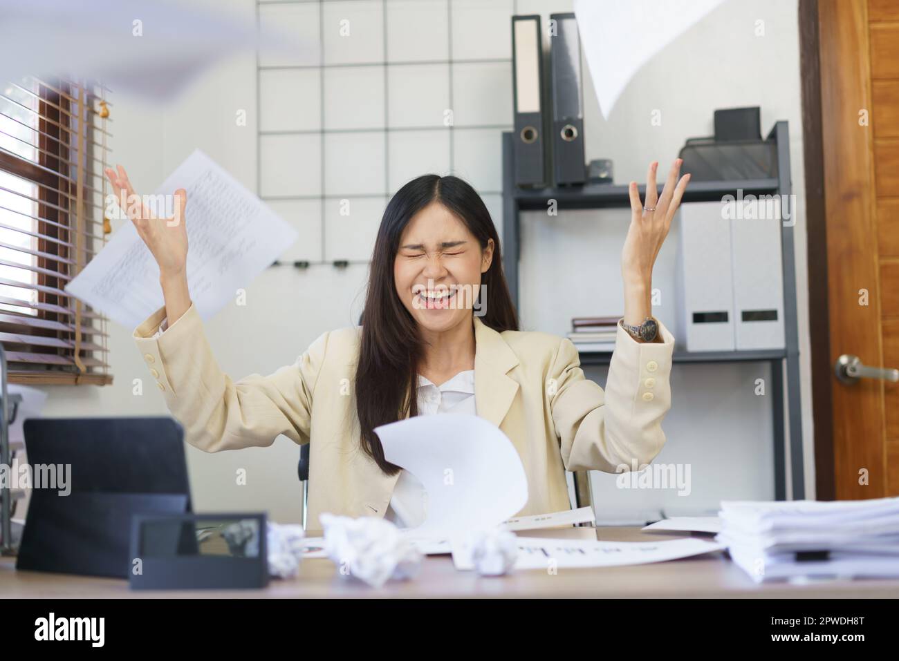 Secretary concept, Female secretary screaming and throwing paper while ...