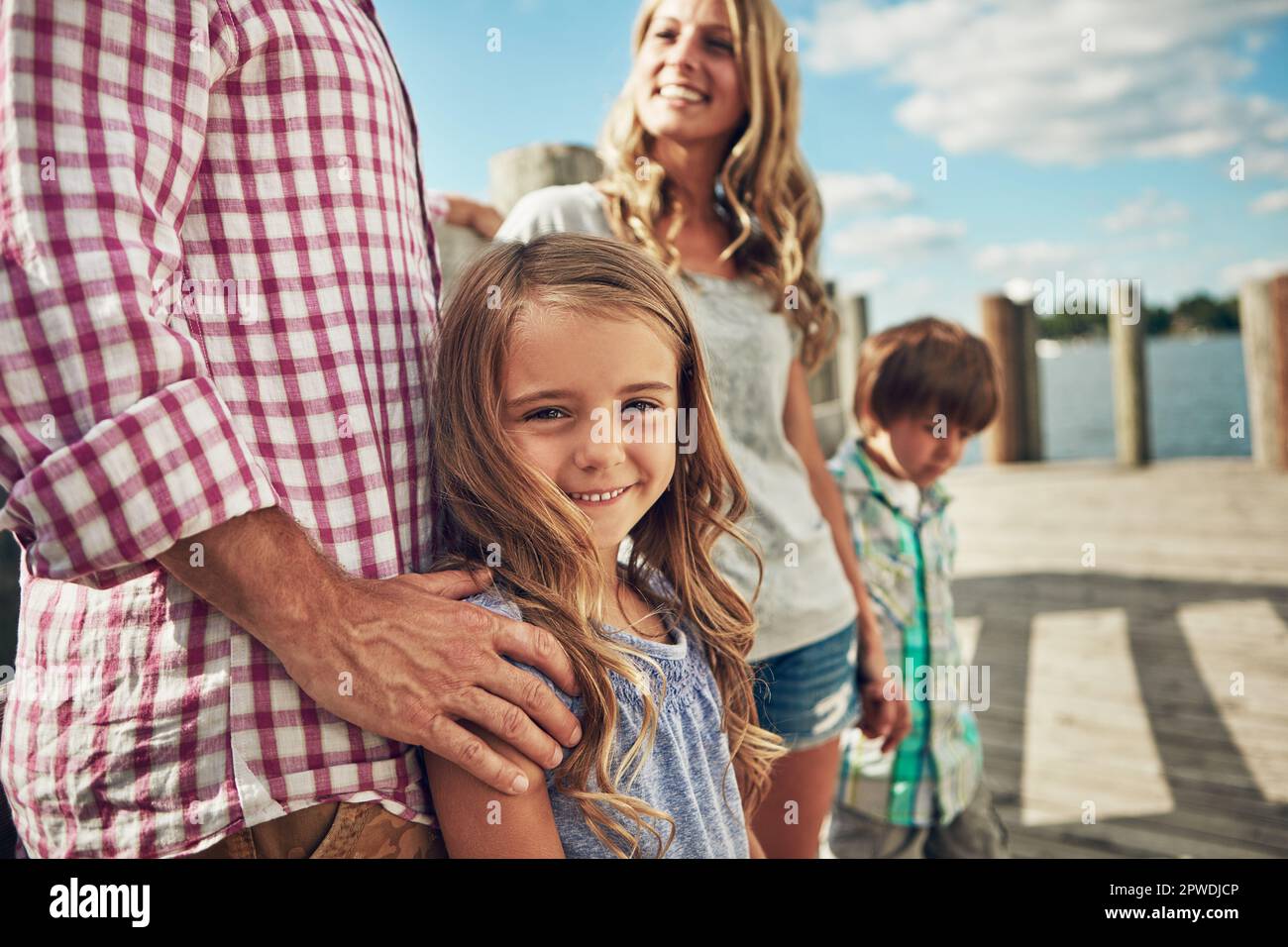 She absolutely loves family outings. a young family on a pier while out ...