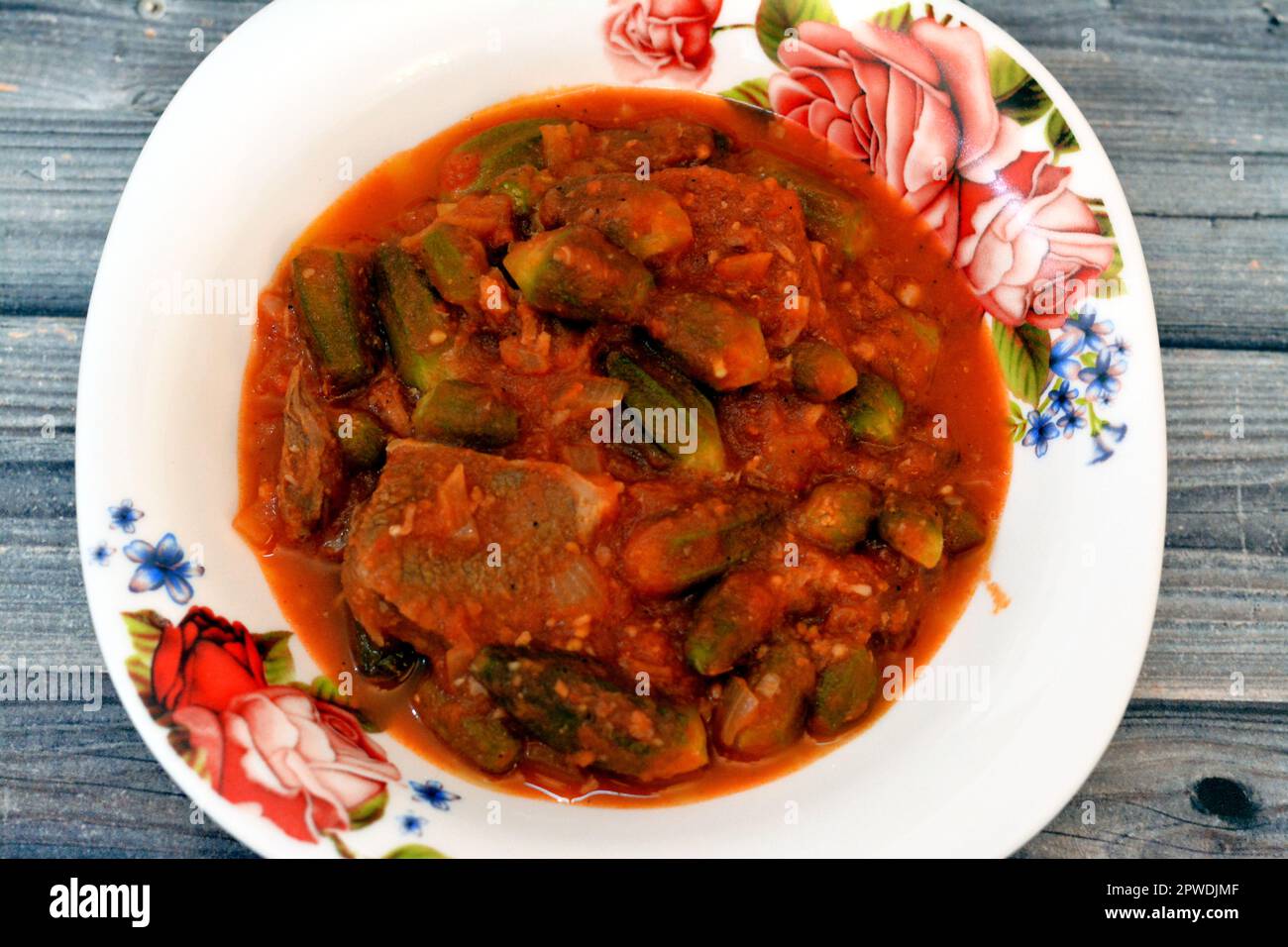 African lady cooking stew hi-res stock photography and images - Alamy