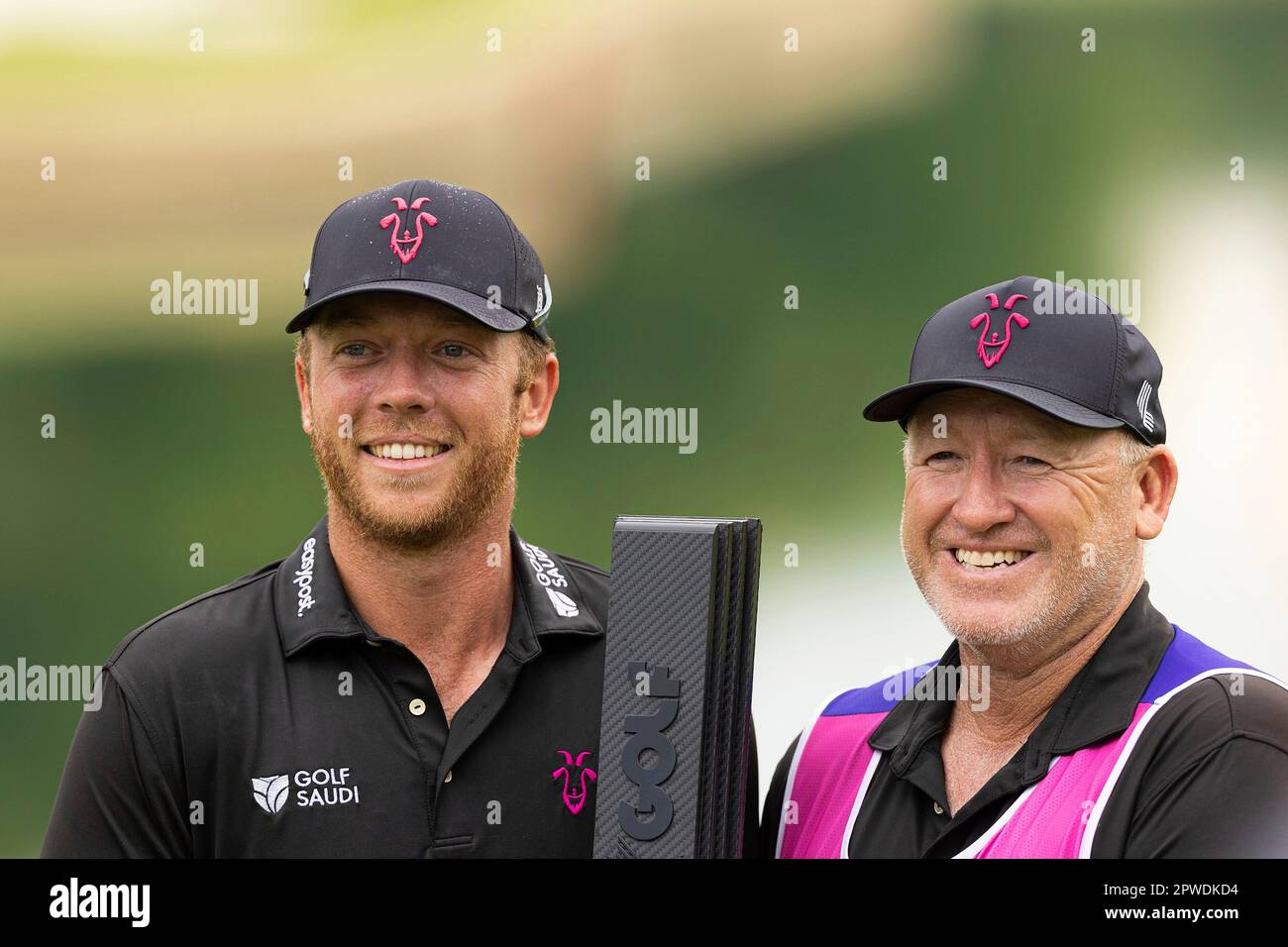 Individual Champion, Talor Gooch of RangeGoats GC and his caddie pose ...