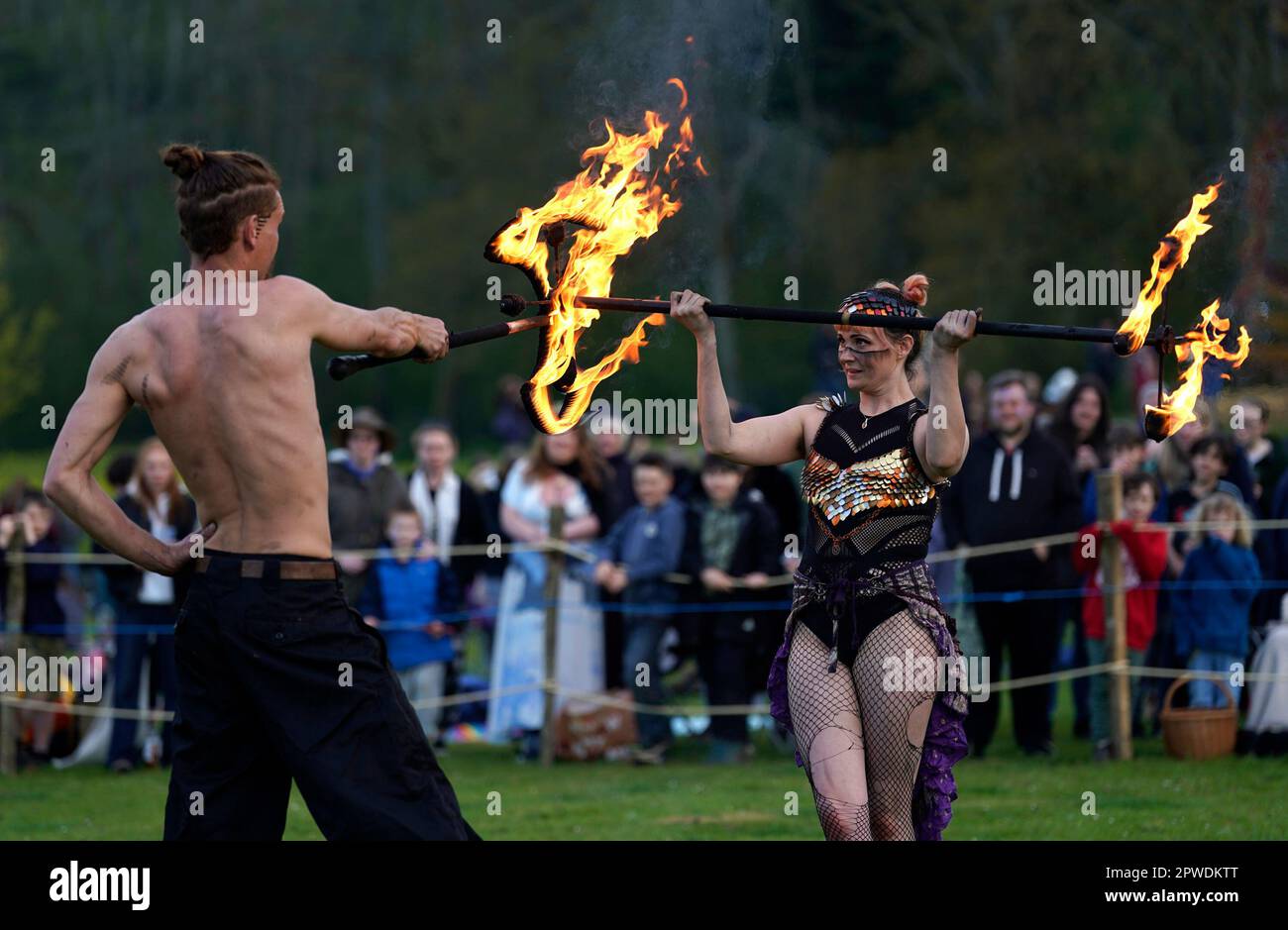 Members of the Steamship Circus fire performers, perform for the crowd ...