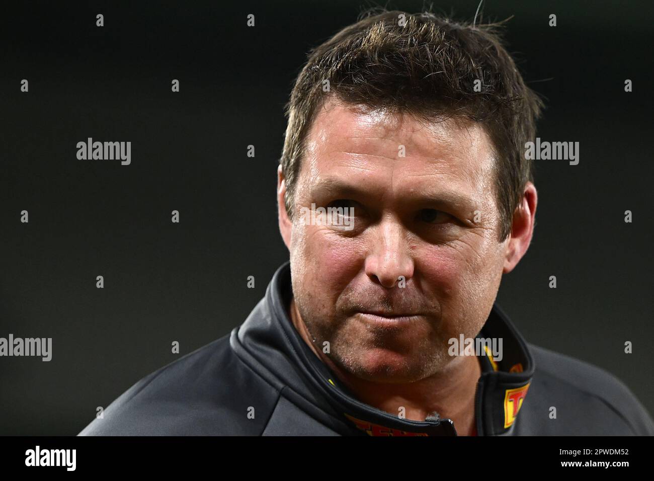 Suns head coach Stuart Dew celebrates with his players during the AFL ...