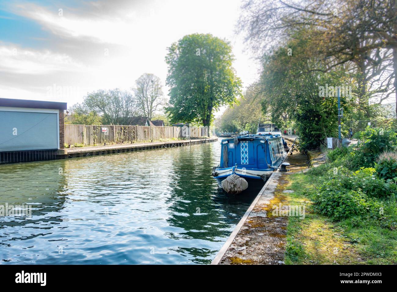 A narrowboat moored on the side of The River Thames at Reading in ...