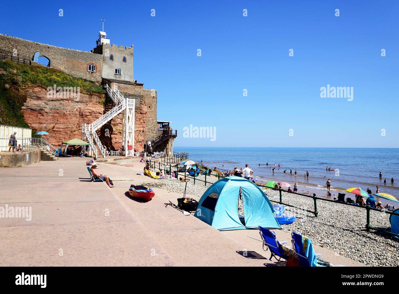Tourists relaxing on Jacobs Ladder beach with the castle on the ...