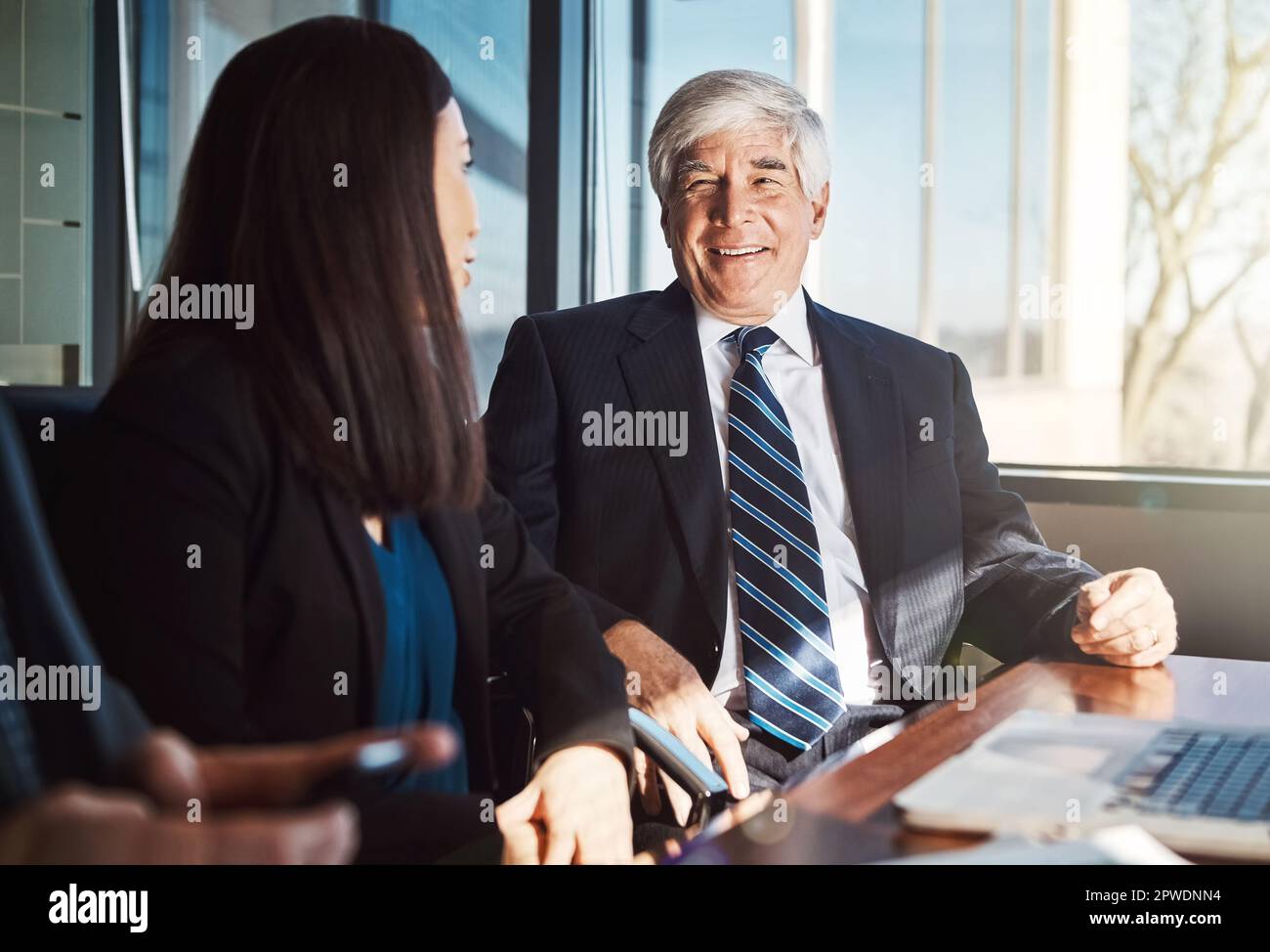 Theyre making great strides together. two businesspeople talking to one ...
