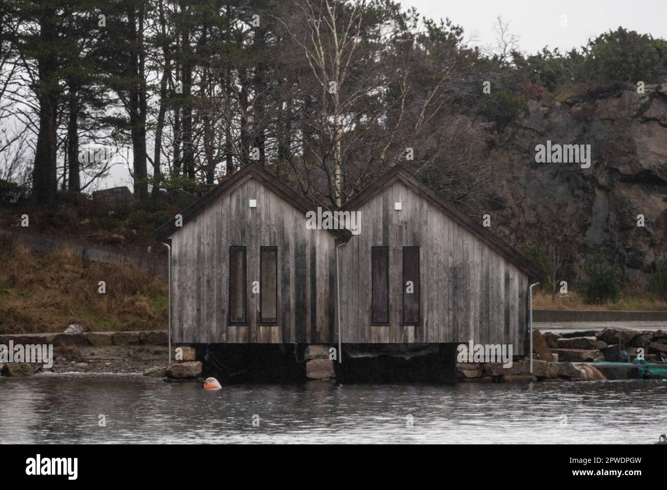 Old untreated wooden boat houses Stock Photo - Alamy