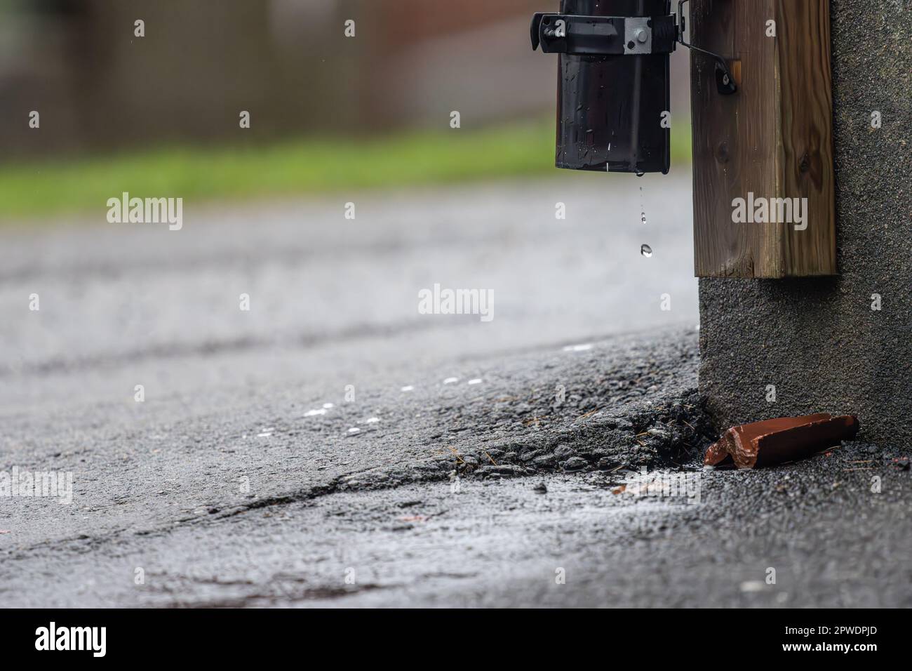 Rain water dropping from a pipe on a wall Stock Photo - Alamy