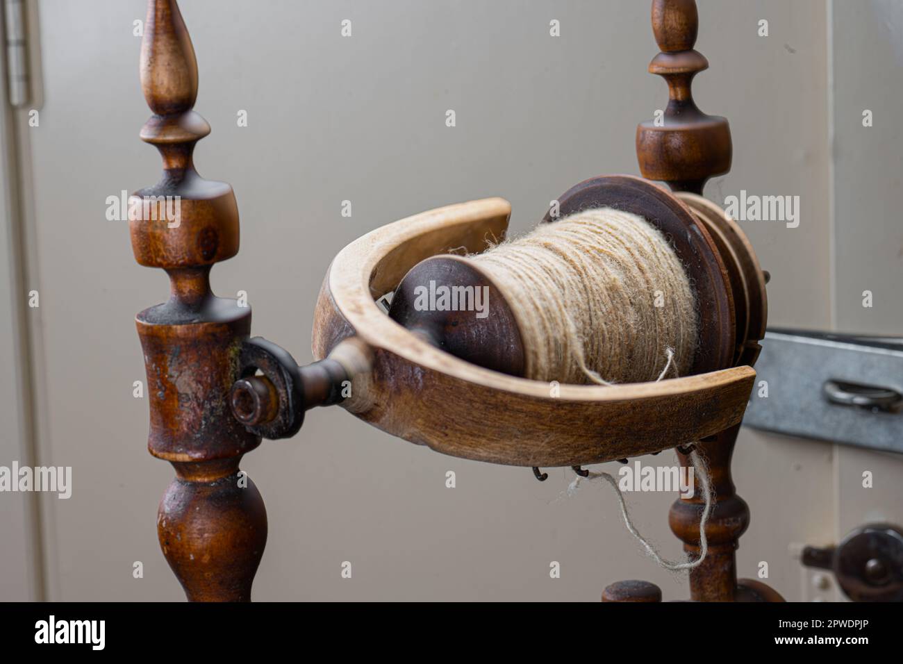 Details of an old wooden spinning rock Stock Photo - Alamy