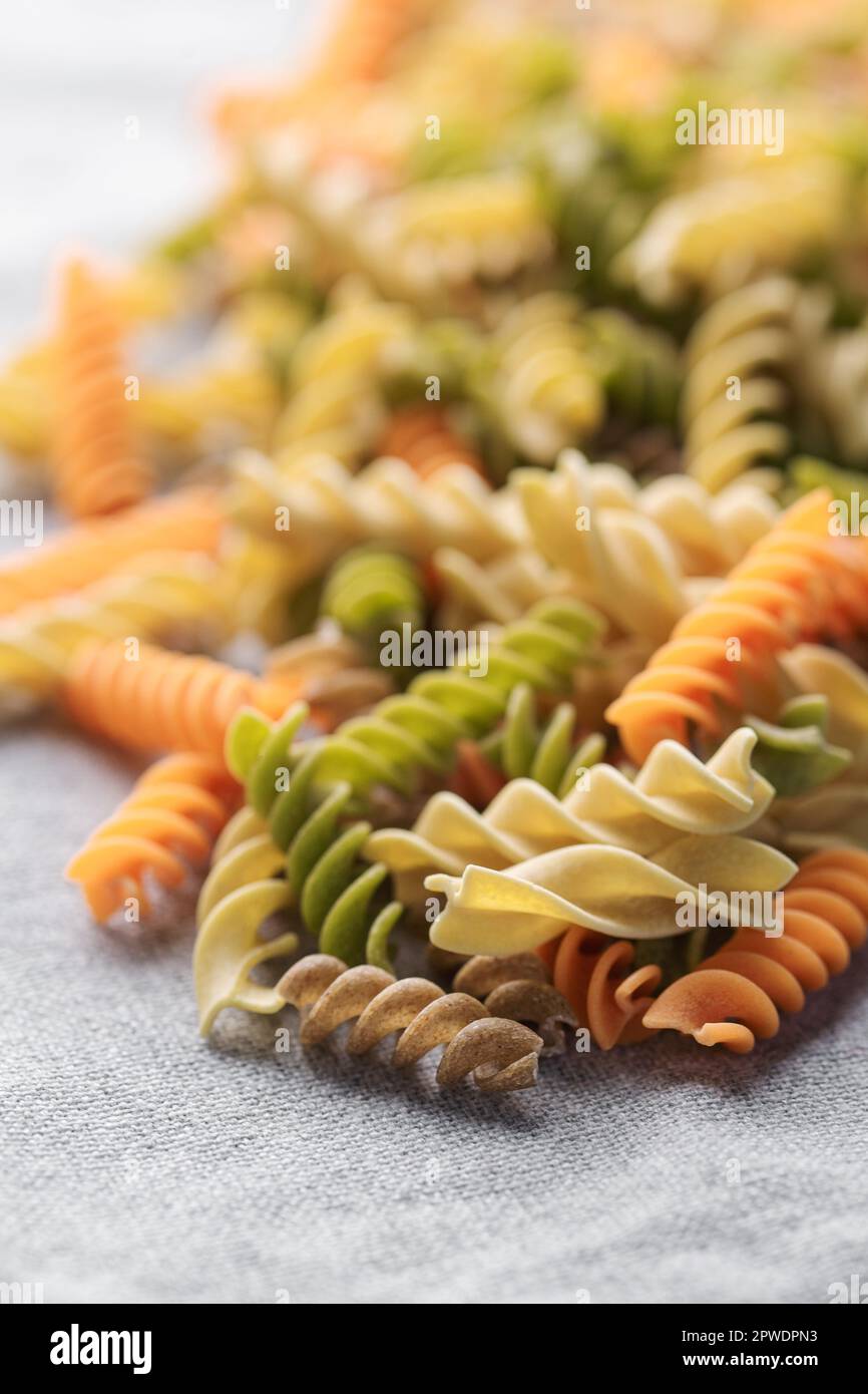A variety of fusilli pasta made from different types of legumes, green ...