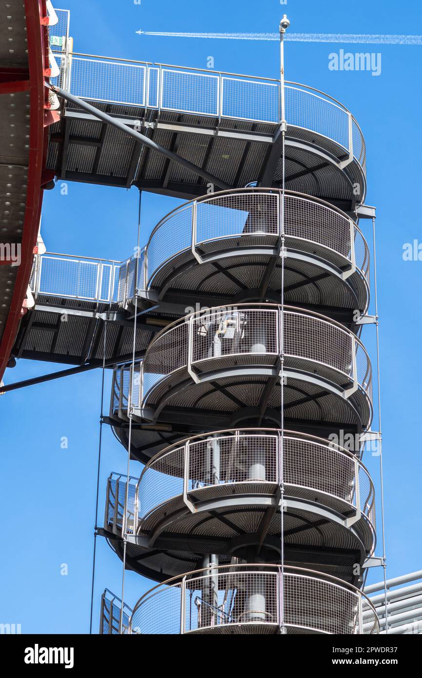 Circular iron staircase for fire escape outside a modern metal ...