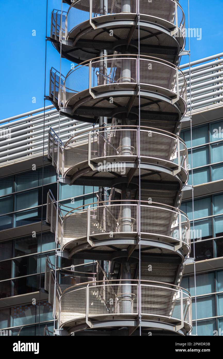 Circular iron staircase for fire escape outside a modern metal ...