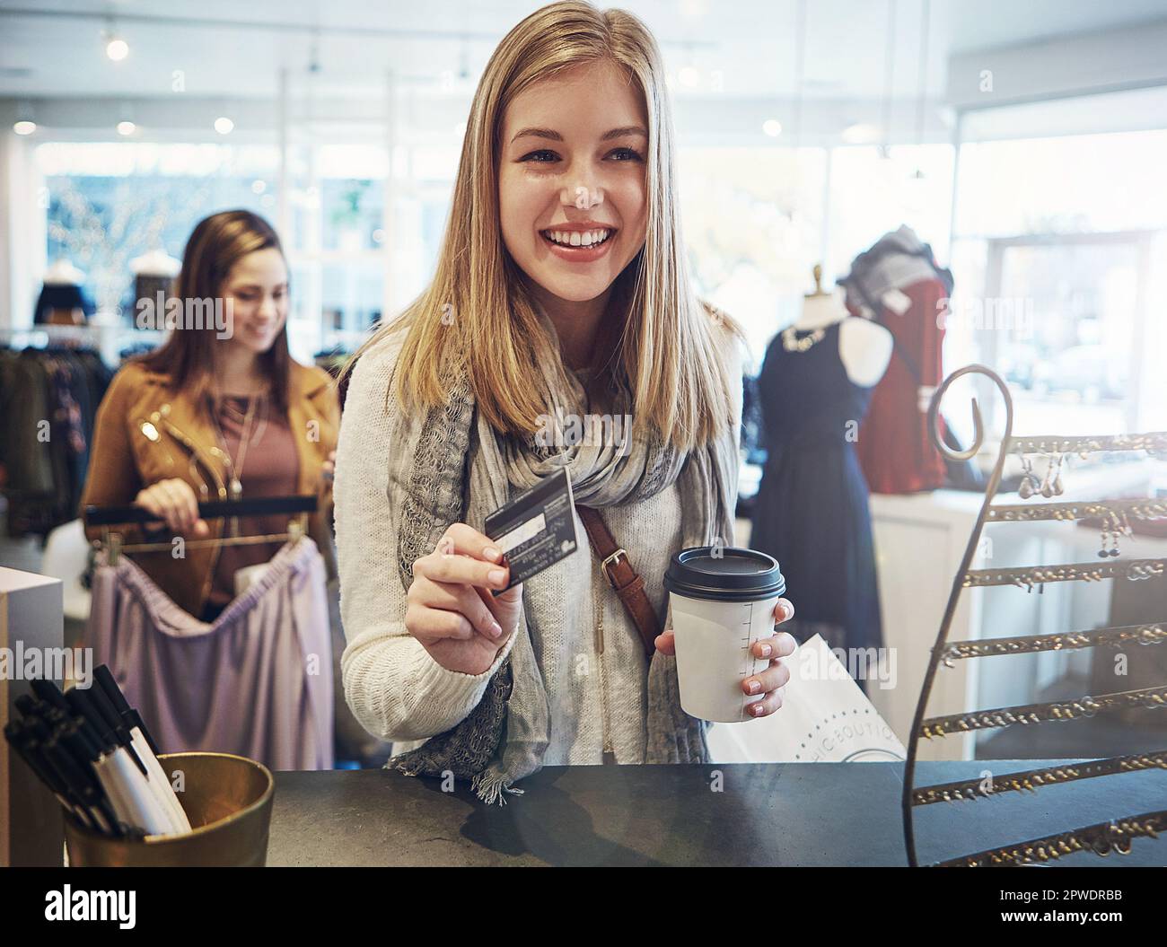 My card never allows me to run out of cash. a young woman ready to pay ...